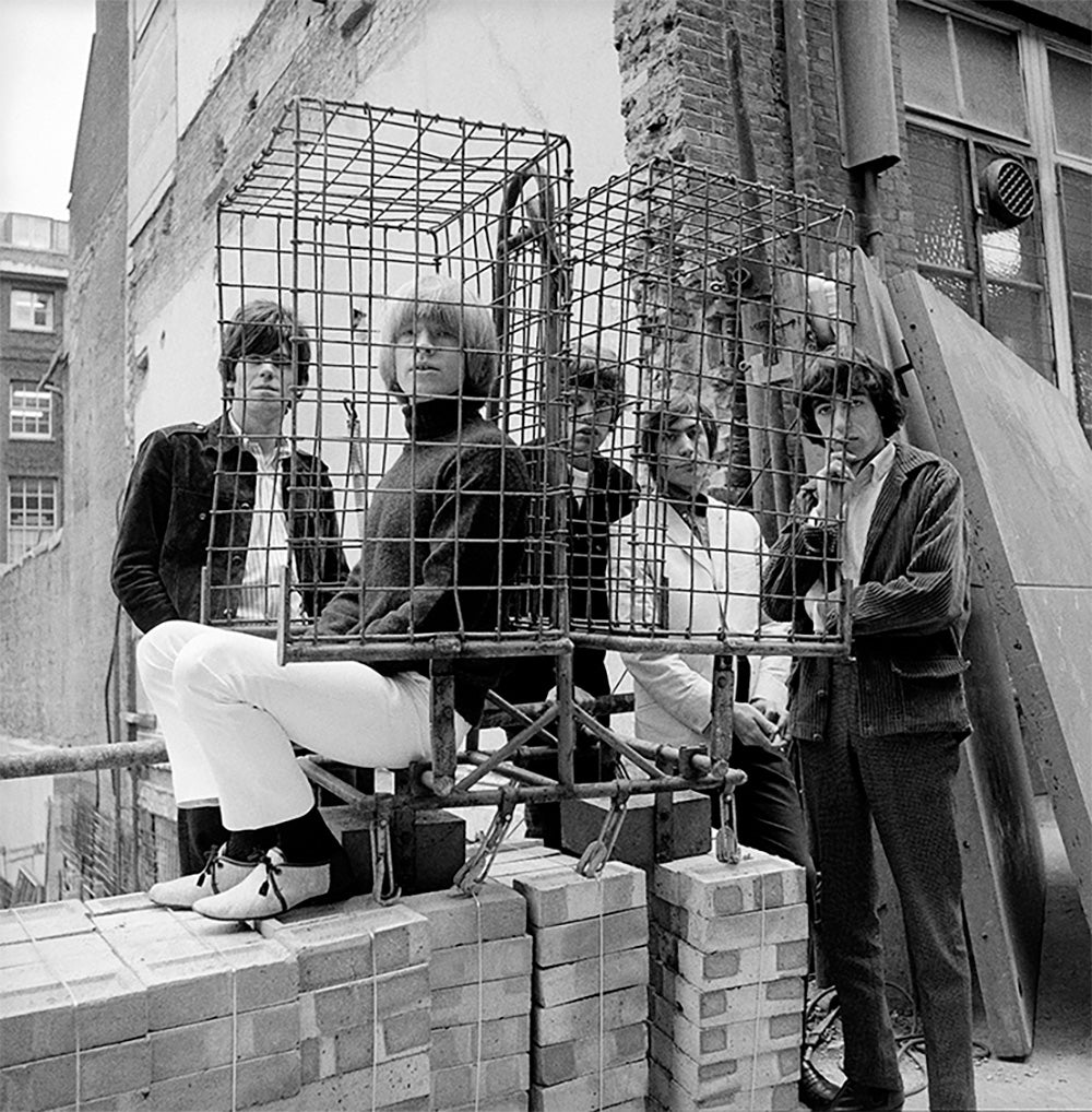 The Rolling Stones photographed behind a cage in Ormond Yard, London ...
