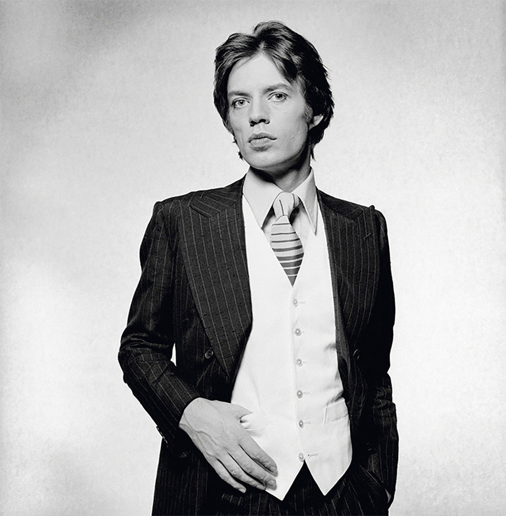 Rolling Stones singer Mick Jagger dressed in a pinstripe suit, 1976 ...