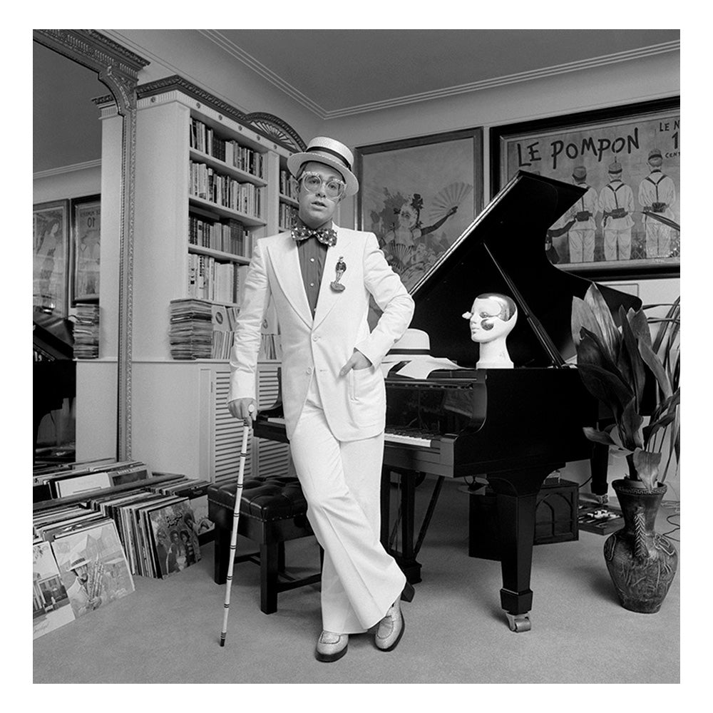Elton John standing at his piano, 1974 — Limited Edition Print - Terry O'Neill | Iconic Images
